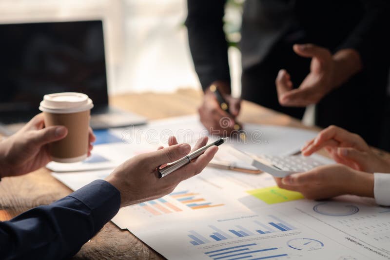 Group Businessmen Point To the Material for the Meeting, Working ...