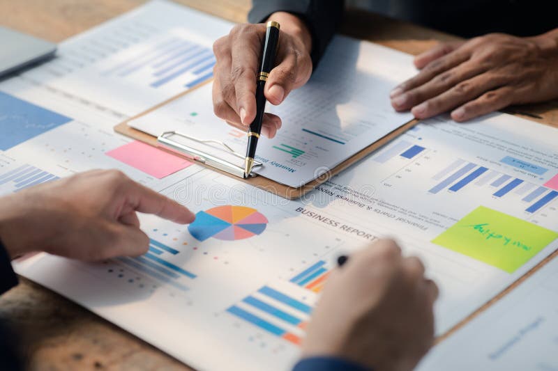 Group Businessmen Point To the Material for the Meeting, Working ...