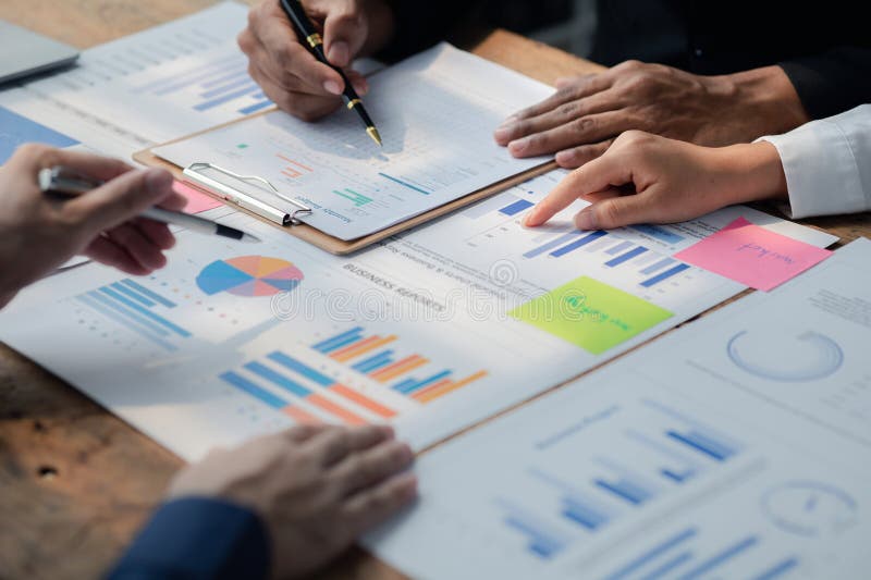 Group Businessmen Point To the Material for the Meeting, Working ...