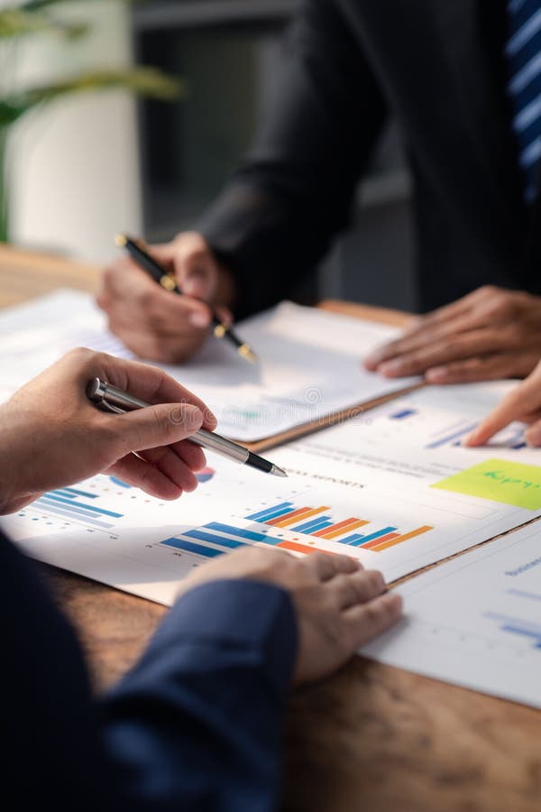 Group Businessmen Point To the Material for the Meeting, Working ...