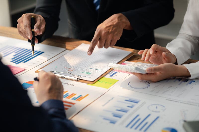 Group Businessmen Point To the Material for the Meeting, Working ...
