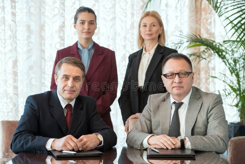 A Group of Businesspeople in Elegant Suits Stock Photo - Image of ...
