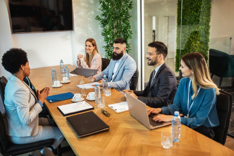 Group of Businesspeople Having a Briefing in a Boardroom Stock Photo ... Group of Businesspeople Having a Briefing in a Boardroom Stock Photo ...