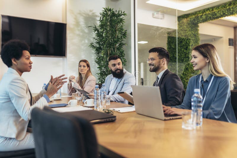 Group of Businesspeople Having a Briefing in a Boardroom Stock Photo ...