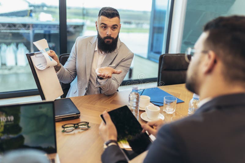 Group of Businesspeople Having a Briefing in a Boardroom Stock Photo ...