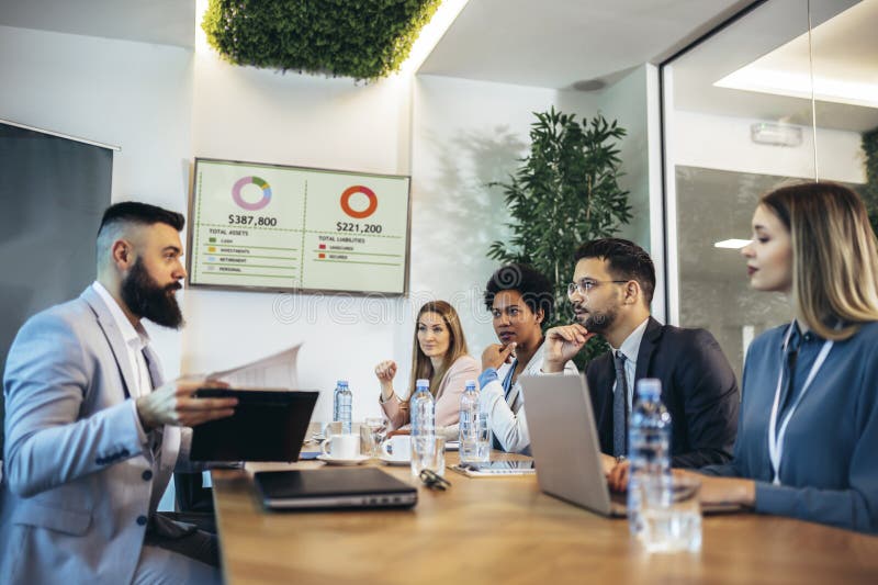 Businesspeople Having a Briefing in a Boardroom. Businesspeople Working ...