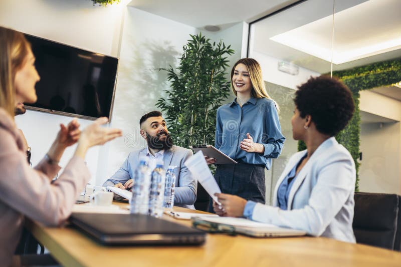 Businesspeople Having a Briefing in a Boardroom. Businesspeople Working ...