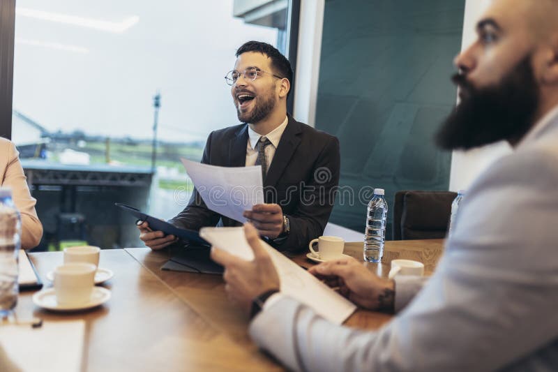 Group of Businesspeople Having a Briefing in a Boardroom Stock Photo ...