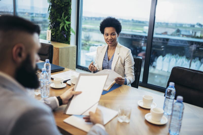 Group of Businesspeople Having a Briefing in a Boardroom Stock Photo ...
