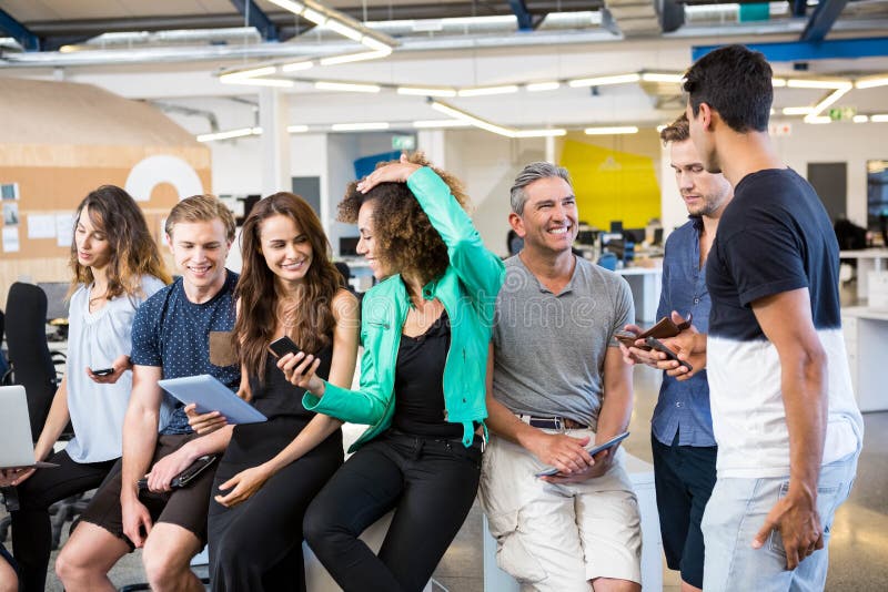 Group of Businesspeople Interacting during Break Time Stock Photo ...