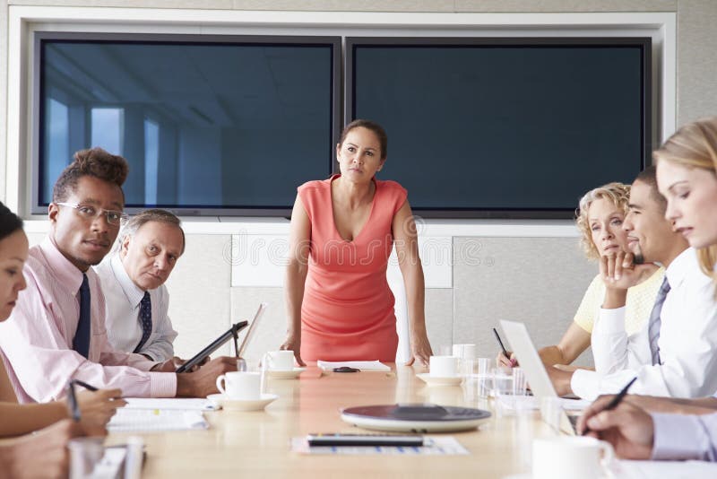 Group of Businesspeople Meeting Around Boardroom Table Stock Photo ...