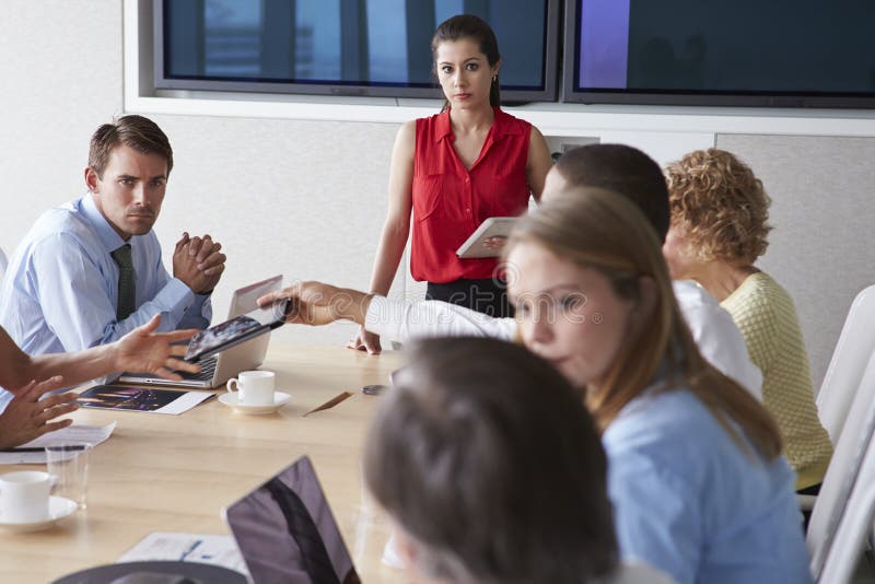 Group of Businesspeople Meeting Around Boardroom Table Stock Image ...