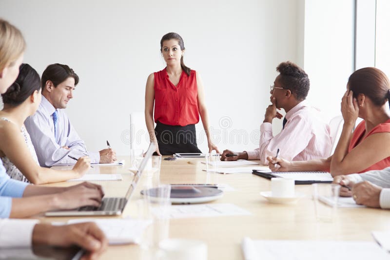 Group of Businesspeople Meeting Around Boardroom Table Stock Photo ...