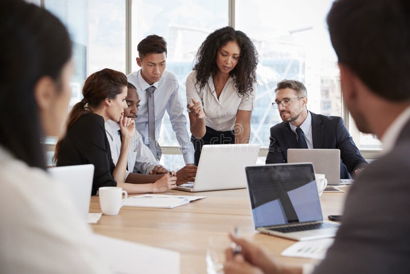 Group of Businesspeople Meeting Around Table in Office Stock Image ...