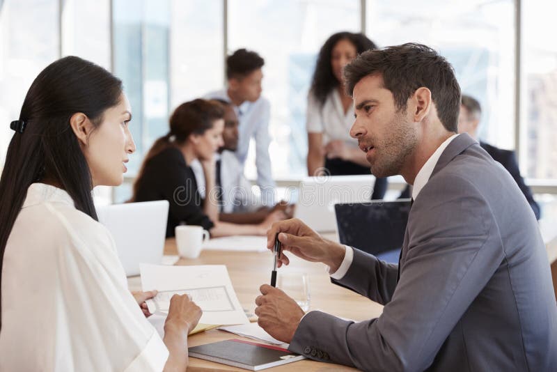Group of Businesspeople Meeting Around Table in Office Stock Photo ...