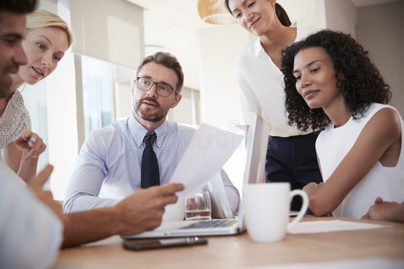 Group of Businesspeople Meeting Around Table in Office Stock Photo ...