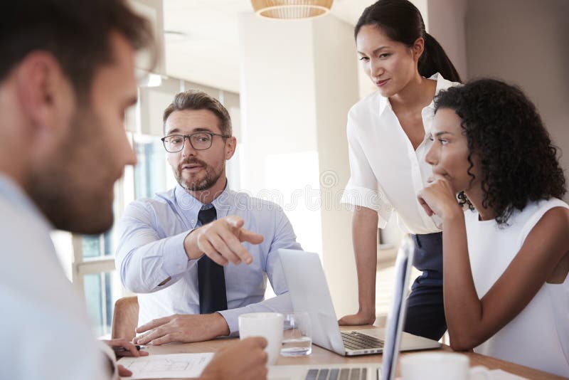 Group of Businesspeople Meeting Around Table in Office Stock Image ...