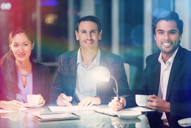 Group of Businesspeople Smiling while Having Coffee Stock Photo - Image ...