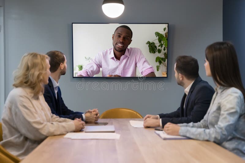Group of Businesspeople Take Part in Videoconference in Boardroom Stock ...