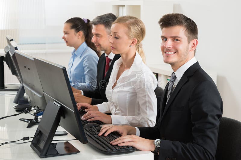 Businesspeople Typing on Desktop Computer Stock Image - Image of career ...