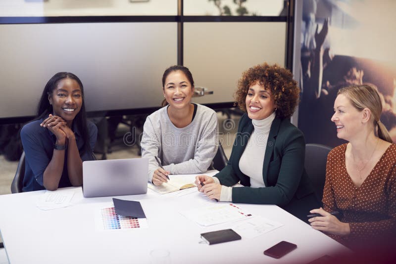 Group of Businesswomen Collaborating in Creative Meeting Around Table ...