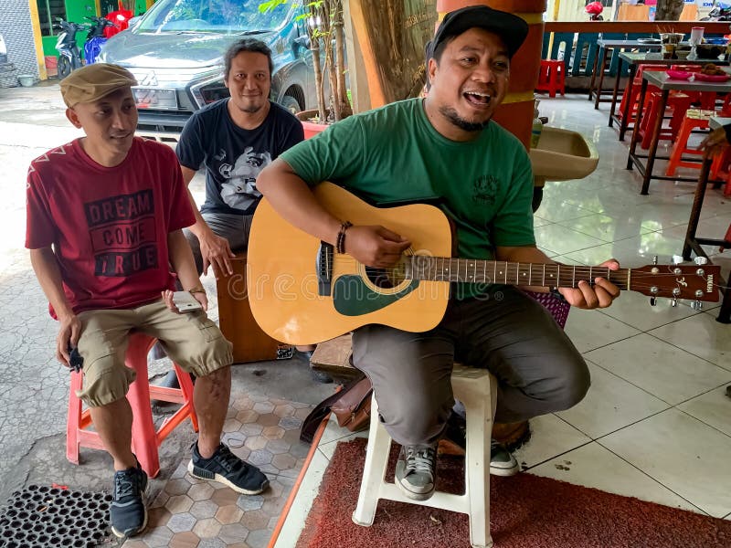 A Group of Buskers in Action at a Corner of a Soto Stall in Semarang ...