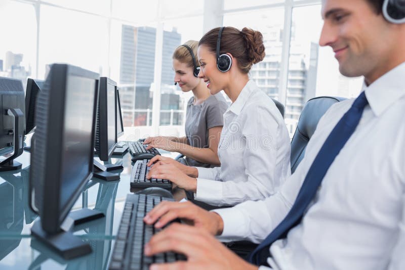 Group of Call Center Agents Working in Line Stock Image - Image of ...