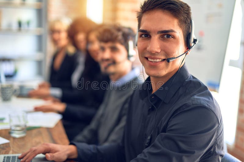 Group of Call Center Workers Working Together with Smile on Face Using ...