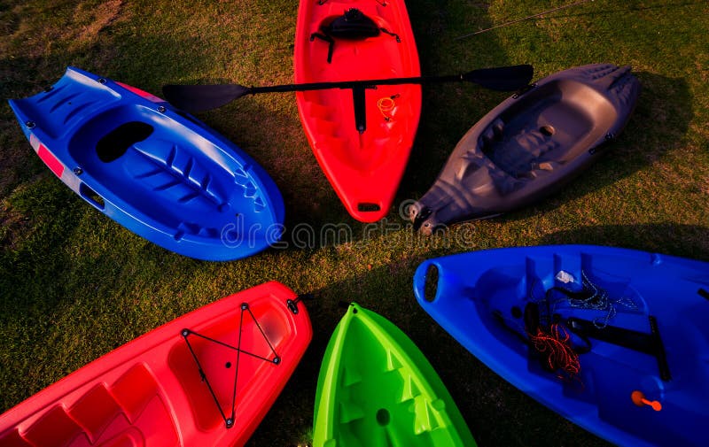 Group of Canoes and Kayaks on a Green Grass Stock Image - Image of life ...