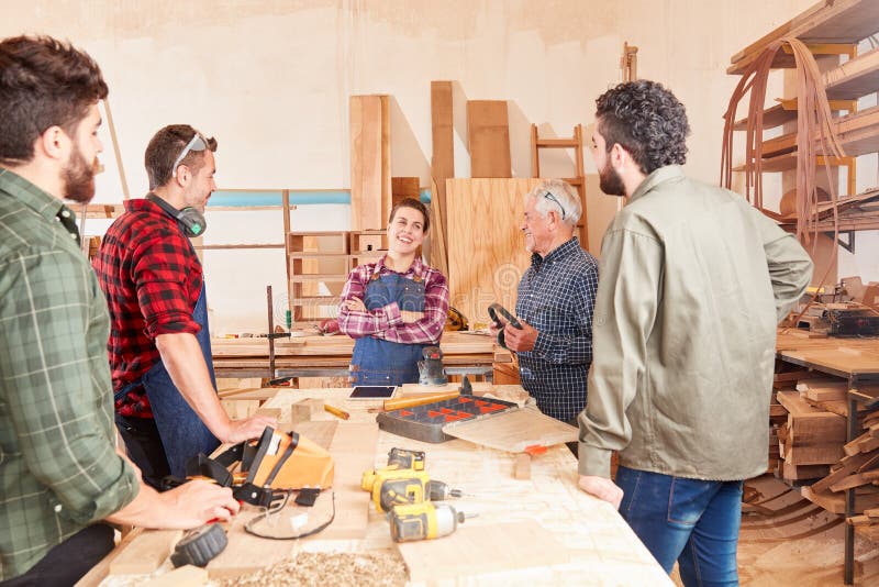 Group of Carpenters with Trainees in the Workshop Stock Photo - Image ...