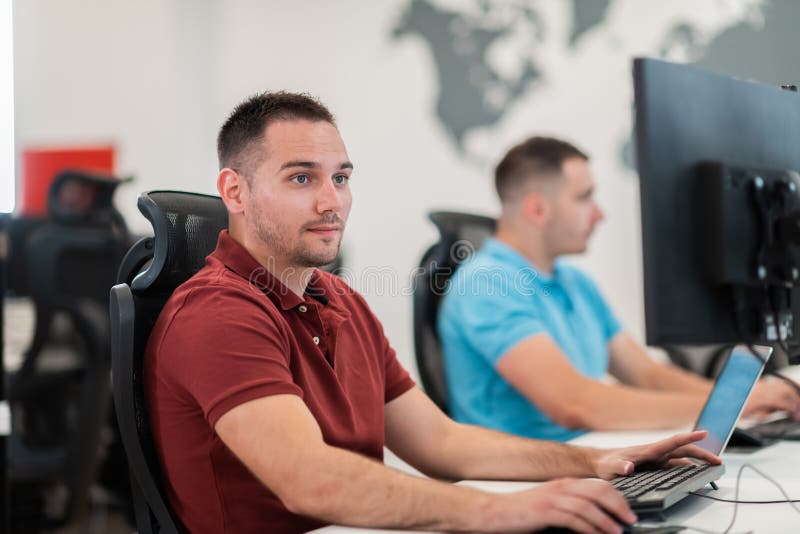 Group of Casual Business Man Working on Desktop Computer in Modern Open ...