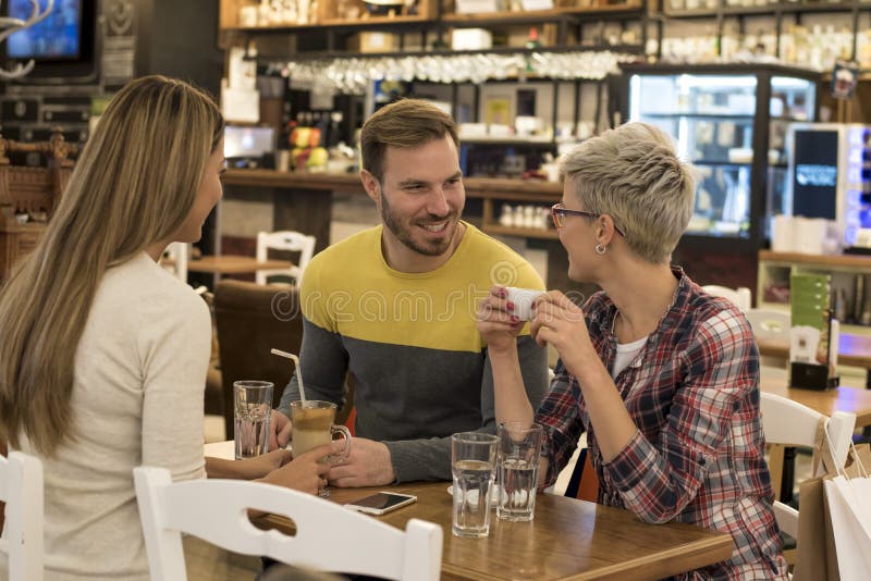 Group of Caucasian Friends Having Fun in a Cafe Stock Photo - Image of ...