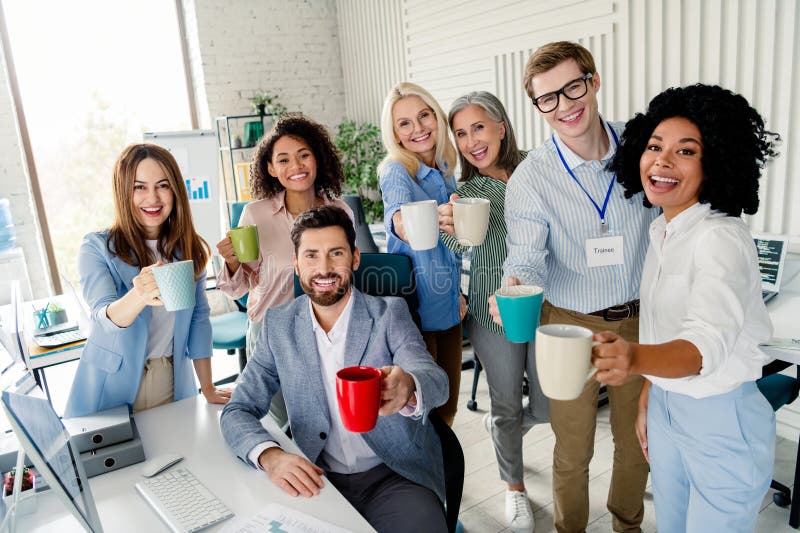 Group of Cheerful Coworkers Enjoying a Coffee Break Together in a ...