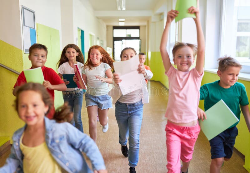 Elementary Students Running in Hallway at School Stock Photo - Image of ...