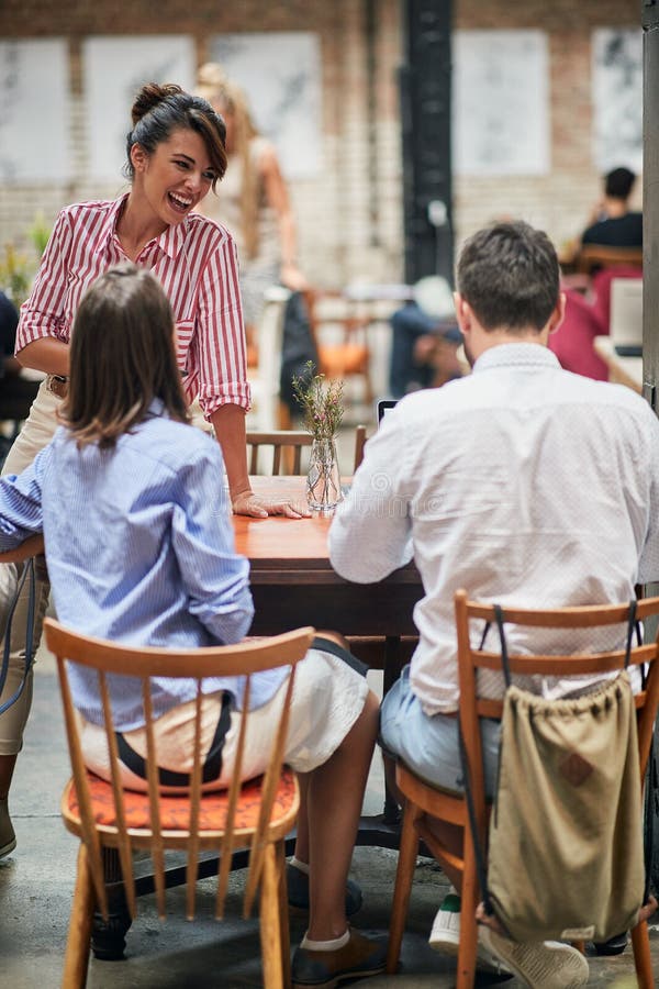 A Group of Cheerful Friends at a Cafe Stock Image - Image of happy ...