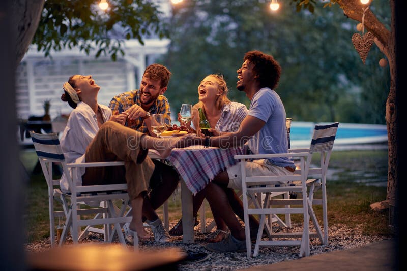 Group of Cheerful Friends Having at Party.People Having Fun at a Dinner ...