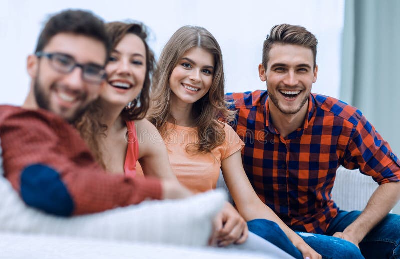Group of Cheerful Friends Sitting on Sofa Stock Photo - Image of ...