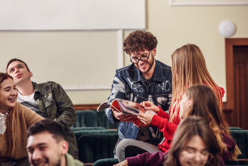 The Group of Cheerful Happy Students Sitting in a Lecture Hall before ...