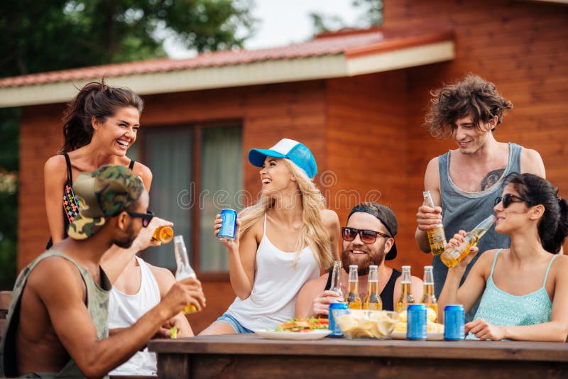 Group of Cheerful Young People Drinking Beer and Laughing Outdoors ...