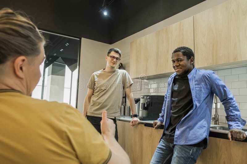 Group of Cheerful Young People Talking and Smiling during Coffee Break ...