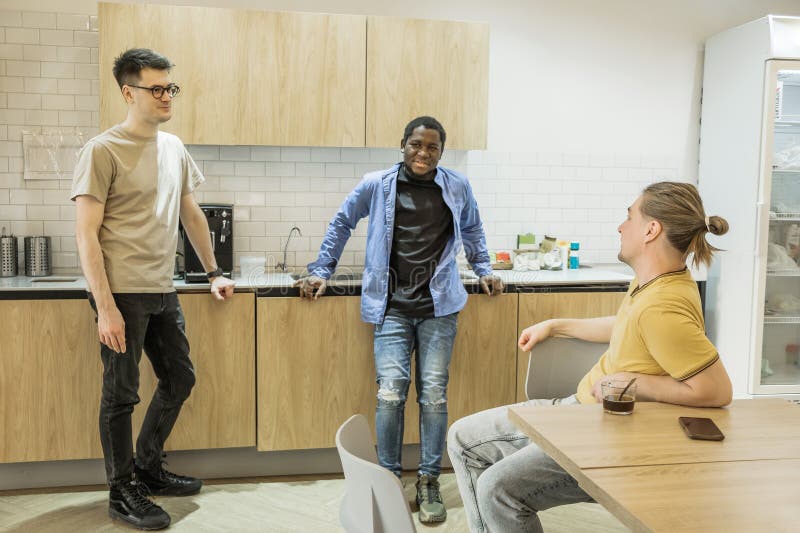Group of Cheerful Young People Talking and Smiling during Coffee Break ...