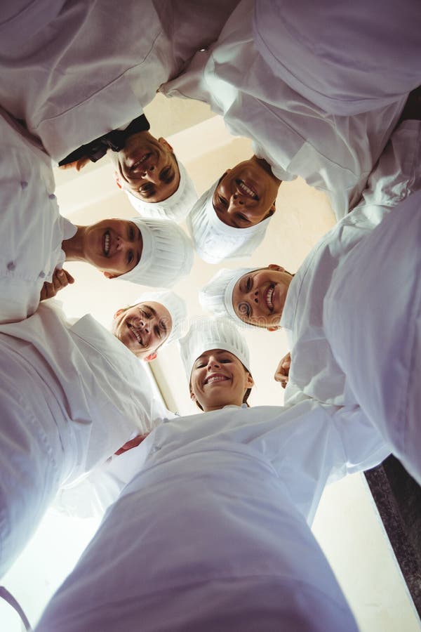 Group of Chefs Formig Huddles in Kitchen Stock Image - Image of ...