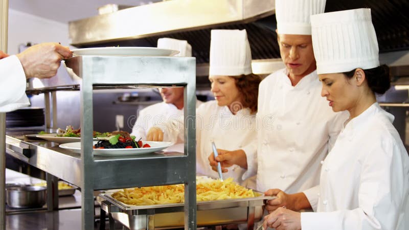 Group of Chefs Giving Plates on Order Line Stock Footage - Video of ...