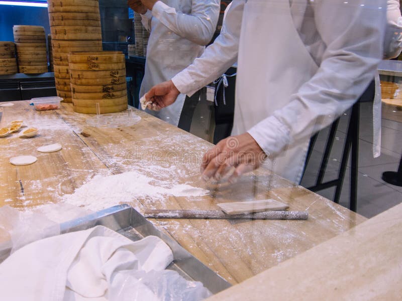A Group of Chefs Making Dumplings in the Restaurant Stock Image - Image ...