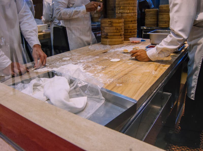 A Group of Chefs Making Dumplings in the Restaurant Stock Photo - Image ...