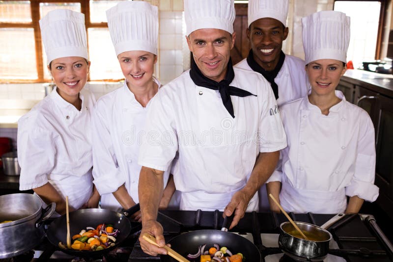 Group of Chefs Preparing Food in Kitchen Stock Image - Image of chefs ...