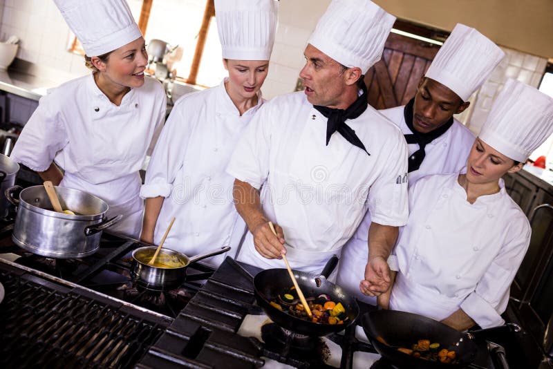 Group of Chefs Preparing Food in Kitchen Stock Image - Image of ...