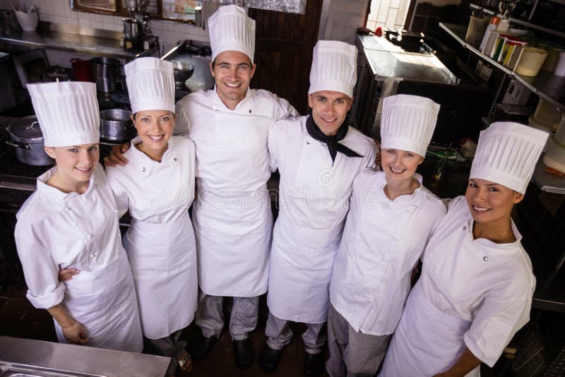 Happy Chefs Team Standing Together In Commercial Kitchen Stock Photo ...