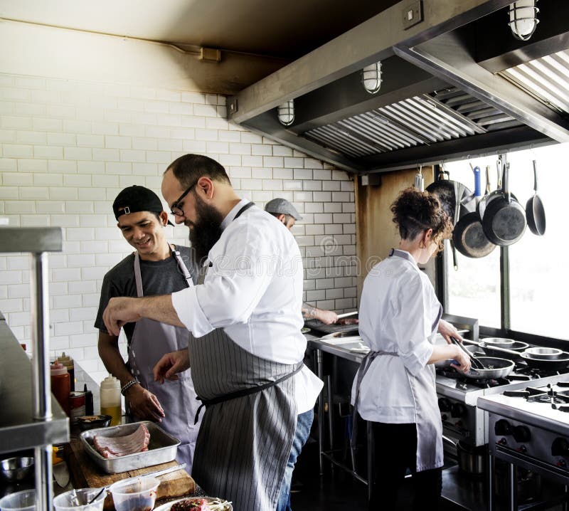 Group of Chefs Working in the Kitchen Stock Photo - Image of counter ...
