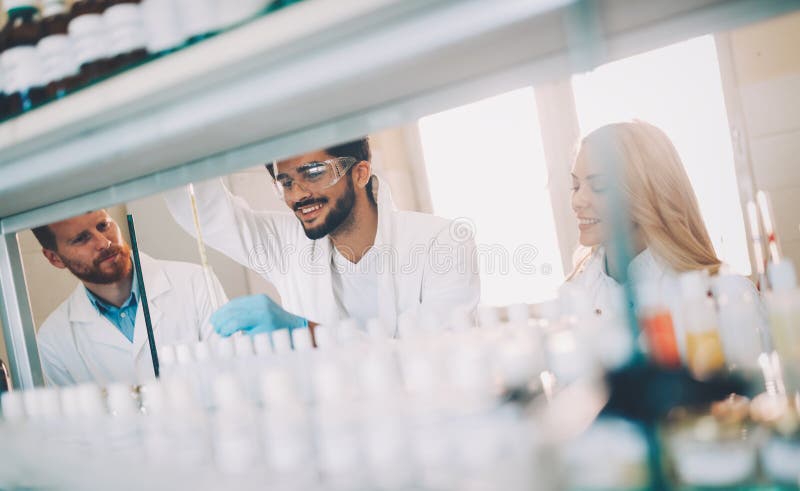 Group of Chemistry Students Working in Laboratory Stock Photo - Image ...